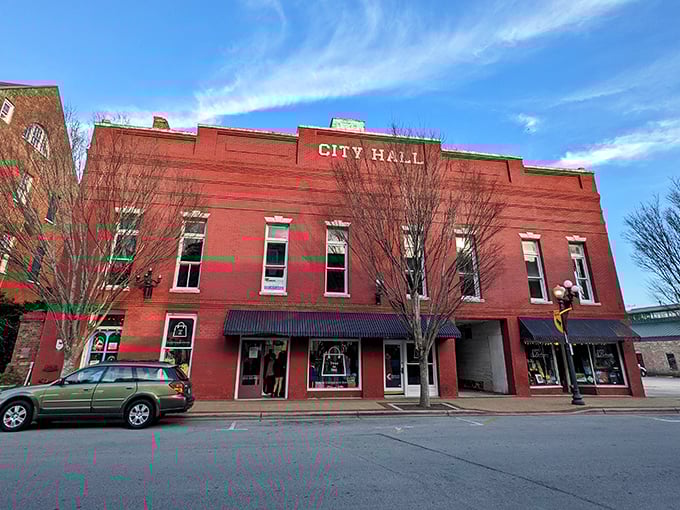 Red brick City Hall anchors New Bern's downtown charm, where coastal living meets inland prices in perfect harmony.