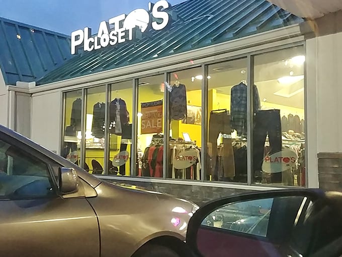 Evening shopping at Plato's Closet reveals a well-lit interior packed with fashion finds at fraction of retail prices.