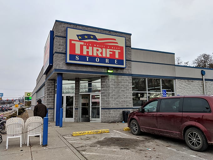 Even on a gray day, the Red, White & Blue Thrift Store sign shines like a beacon for budget shoppers.