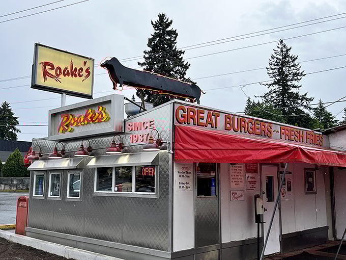 The vintage car on the sign hints at simpler times, when drive-ins ruled and every meal felt like a celebration.