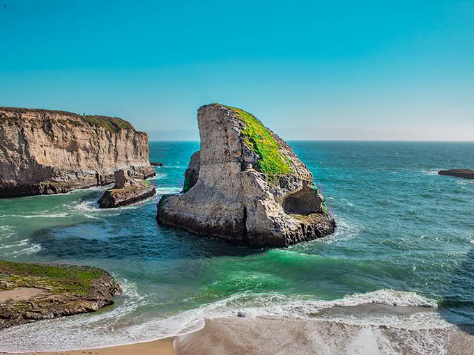 The emerald waters around Shark Fin Cove create a striking contrast with the rugged cliffs—California coastal perfection.