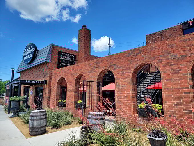 The arched windows and brick façade of Hutchins give it that "been here forever" vibe that great BBQ joints earn over time.