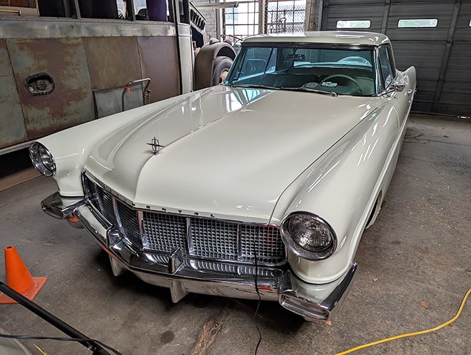 The pristine 1956 Lincoln Continental Mark II—automotive royalty that whispers of Sinatra, martinis, and an America riding high on post-war prosperity.