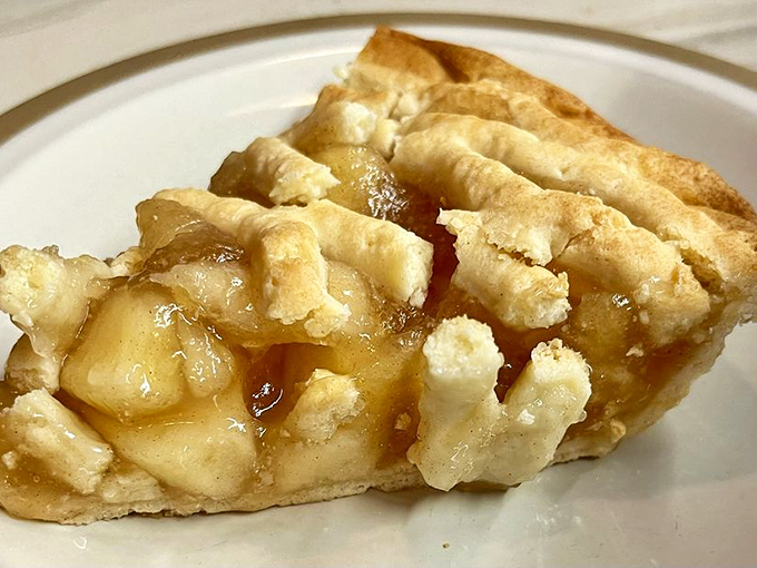 A slice of apple pie that would make Grandma jealous. That flaky crust and glistening filling is the reason buttons pop and belts loosen across America.