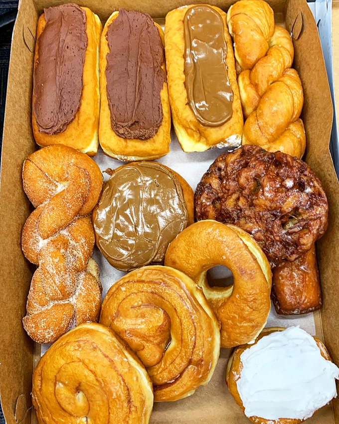 Donut paradise in a box—where cinnamon twists, chocolate-frosted long johns, and glazed perfection make breakfast feel like a celebration worth getting up for.