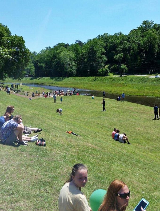 Autauga Creek draws families to its grassy banks on sunny days, creating a community gathering spot where memories are made.