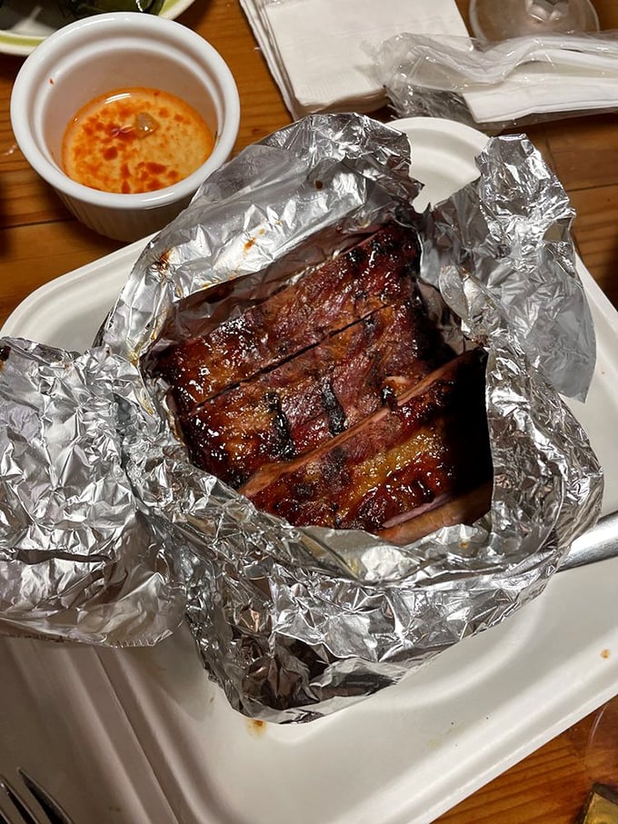 Ribs that glisten with a lacquered finish—the kind that make you temporarily forget table manners exist.