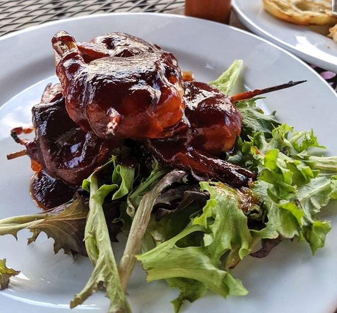 These bacon-wrapped shrimp perched atop fresh greens look like they're auditioning for a food magazine cover—and getting the job on the first try.