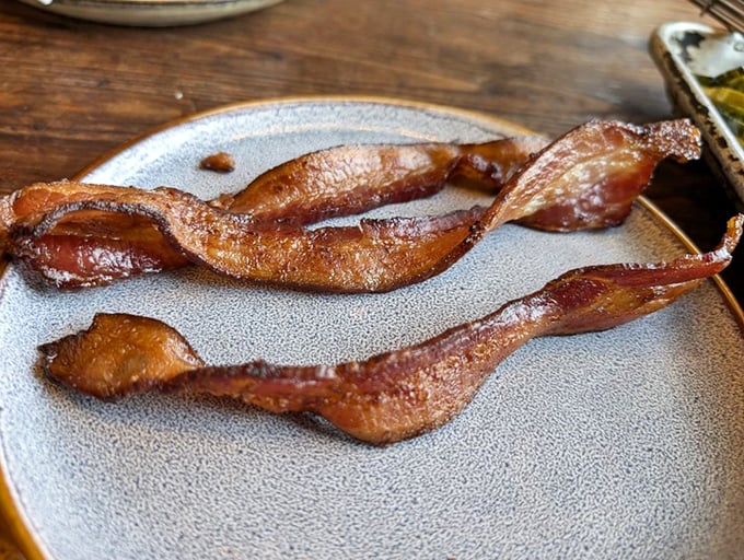 Bacon that's been transformed from breakfast sidekick to main character – thick-cut, perfectly rendered, and worthy of its own standing ovation.