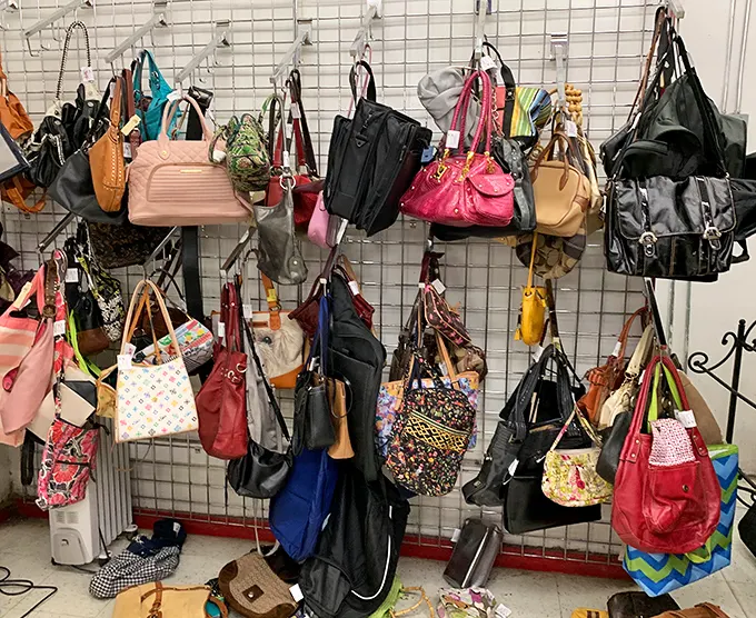Handbag heaven or purse purgatory? This wall of accessories tells a thousand fashion stories, from designer knockoffs to genuine vintage finds.
