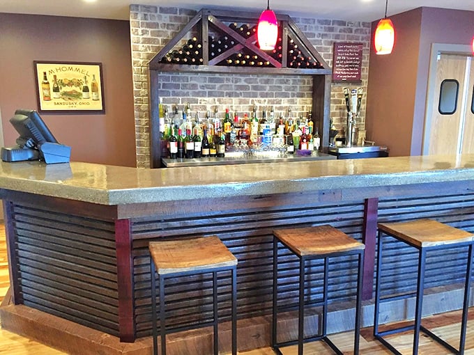 The bar area isn't just serving drinks—it's creating a cozy corner where locals swap stories and visitors become honorary Sanduskians.