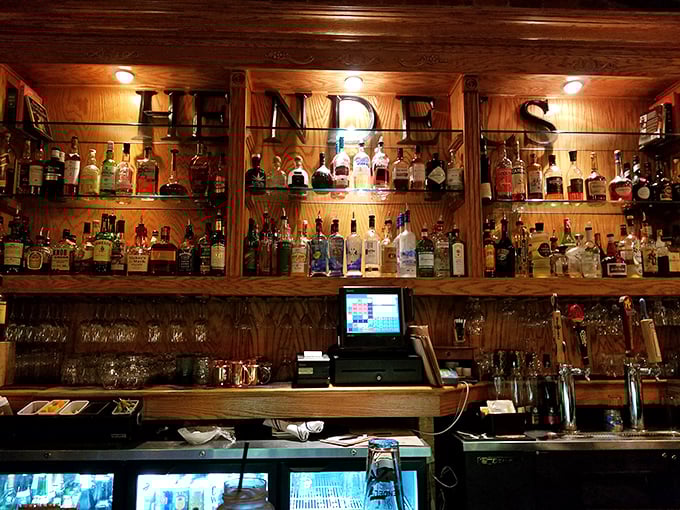 The bar at Hendel's doesn't just serve drinks—it tells stories through bottles arranged like a liquid library of good times waiting to happen.
