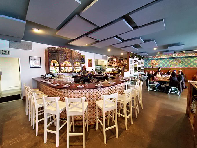 The bar isn't just where drinks are made—it's theater-in-the-round where culinary magic happens before your very eyes.
