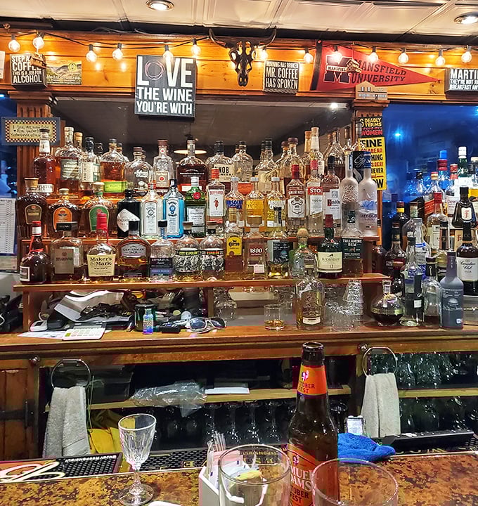 The bar boasts enough spirits to lift anyone's—well, spirits. That "Love the wine you're with" sign speaks universal truth.