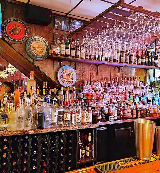 The bar doesn't just stock bottles; it showcases a liquid museum of spirits where military insignias remind you to salute your perfectly crafted old fashioned.
