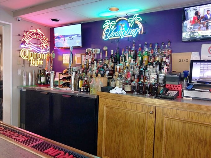 The neon-lit bar glows with promise – like a lighthouse for thirsty sailors navigating the treacherous waters of a long workweek.