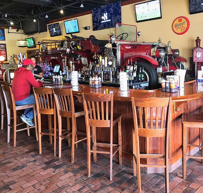 A bar built from an actual fire truck—because why not? The perfect spot to belly up for a cold one after conquering the meat sweats.