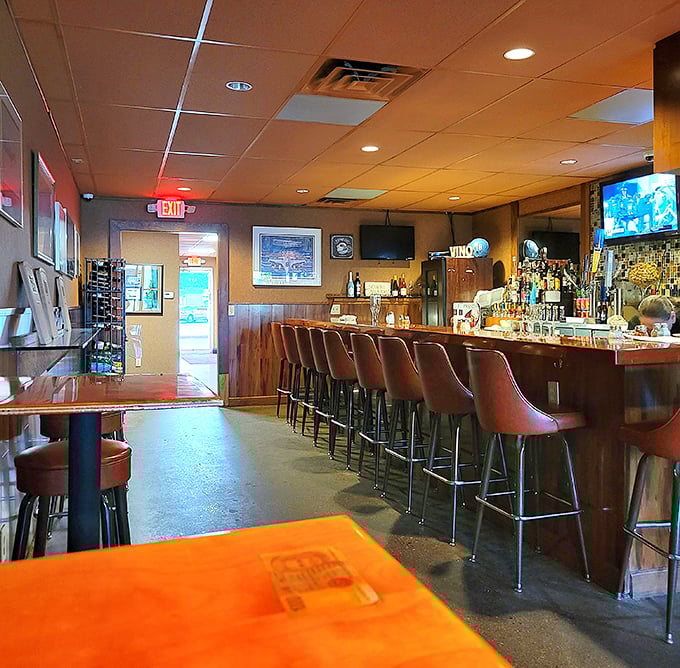 The bar area – where solo diners find community, sports fans find camaraderie, and everyone finds a good pour without pretentious mixology.