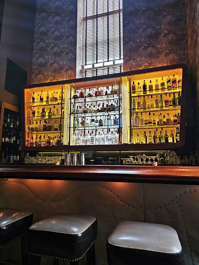 This isn't just a bar—it's a liquid library where each bottle is a volume of distilled wisdom waiting to be consulted.