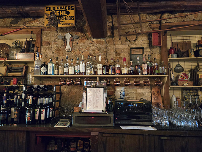 The bar area doesn't just serve drinks—it serves history, with stone walls that have absorbed decades of laughter, clinking glasses, and "I shouldn't, but okay."