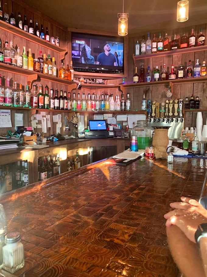 A bar stocked so thoroughly it looks like it could survive both apocalypse and prohibition – liquid comfort for every palate.