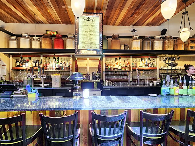 The bar area showcases rustic charm with modern efficiency, creating the perfect backdrop for memorable dining experiences.