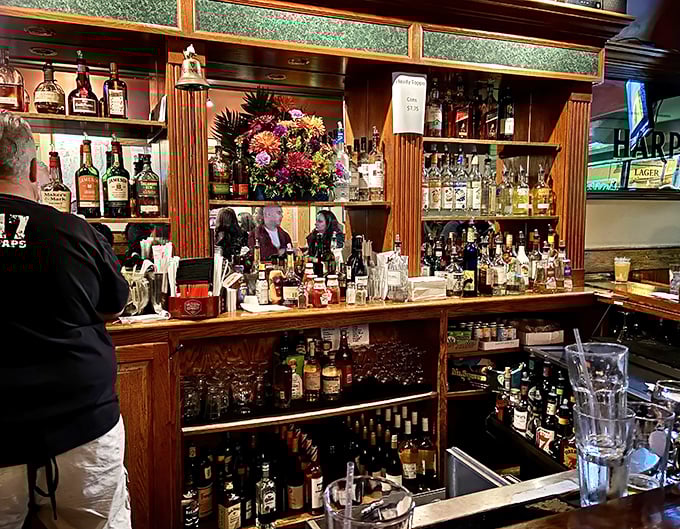 Behind this well-stocked bar, bottles gleam like treasures in a pirate's chest – liquid gold waiting to be transformed into happiness.