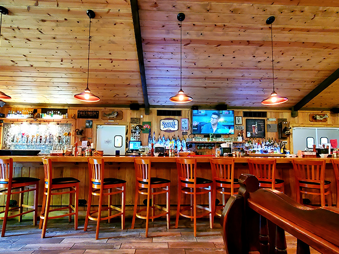 The well-stocked bar promises liquid refreshment after a day of mountain adventures. Samuel Adams tap handle hints at craft beer options.
