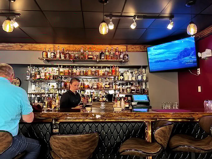 The bar showcases an impressive bourbon collection that would make Kentucky proud, all waiting to complement your steak or stand proudly on their own.