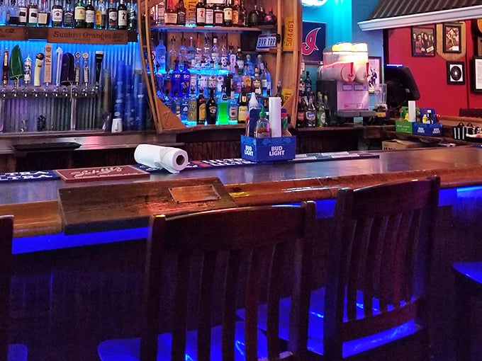 The bar glows with promise and possibility, a beacon for thirsty travelers in a sea of memorabilia.