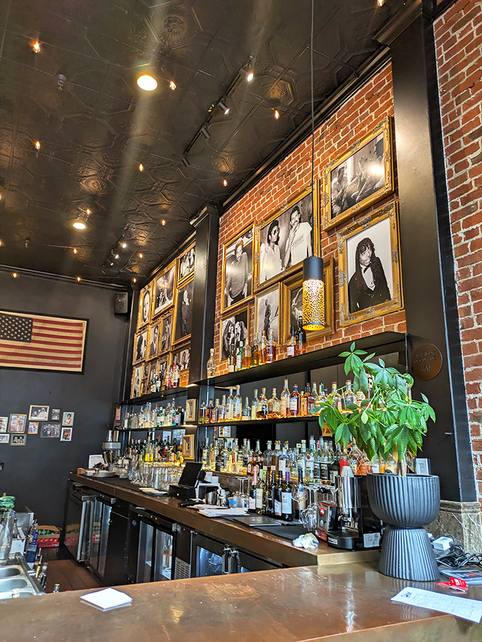 The bar area balances brick, wood, and photographs in a space that feels simultaneously modern and timeless—like great barbecue itself.
