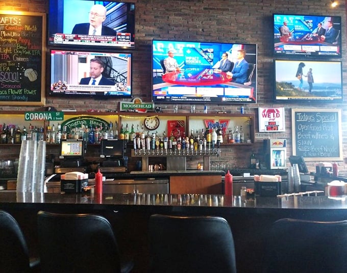 The bar at Dino's – where libations flow, sports commentary flourishes, and the debate over best wing sauce never ends.