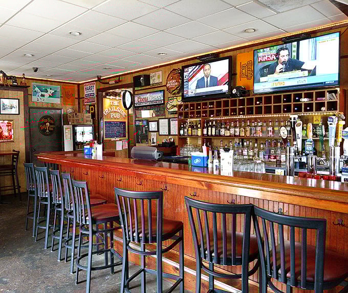 The bar beckons with its polished wood and perfect row of stools – a democratic institution where cyclists and locals find common ground in good drinks.