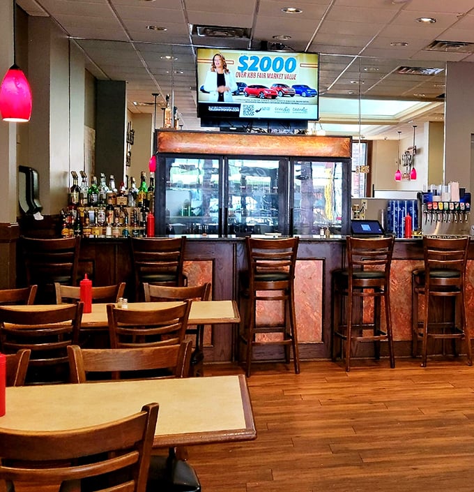 The bar area offers a front-row seat to Cambridge social life, where locals gather to share stories as freely as they share appetizers.