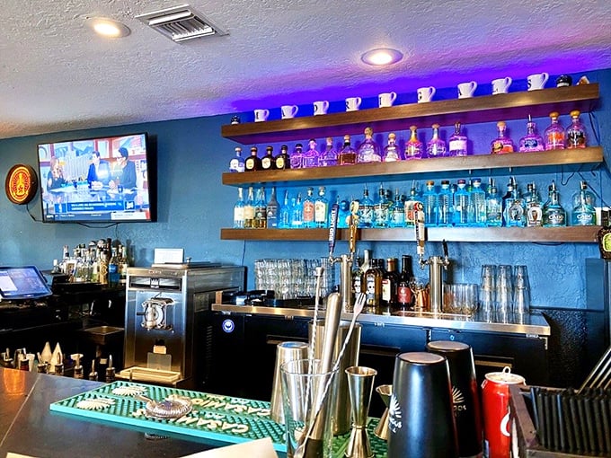 The bar shelves lined with tequila bottles like soldiers ready for duty. Each one holds the promise of margarita excellence.