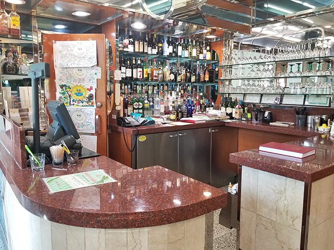The bar area gleams with promise, a testament to the diner's evolution beyond breakfast into full-service dining and evening libations.
