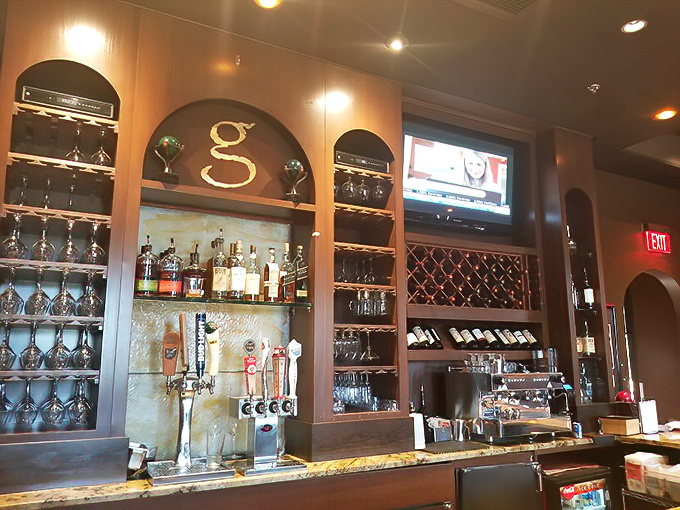 The bar's elegant "g" monogram and impressive wine display signal that your evening's libations are in very capable hands.