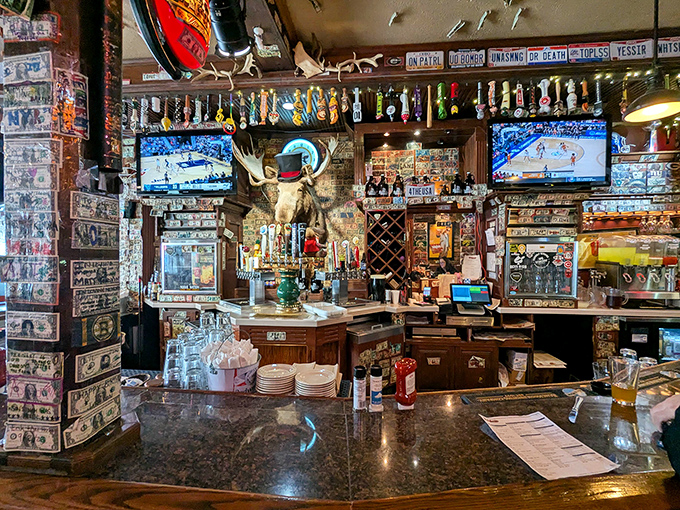 A bar area where dollar bills and memorabilia create a tapestry of local history—each item with its own story waiting to be told.