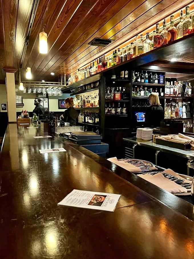 A bar stocked for serious business—where bartenders craft cocktails with the same precision that the kitchen applies to its steaks.