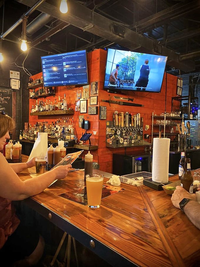 The bar at Meat BBQ – where sauce bottles stand at attention and cold beer flows freely, ready to complement whatever smoky treasure you've ordered.
