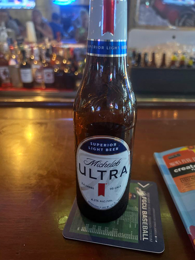 A cold Michelob Ultra waiting patiently on the bar—because sometimes you need something light to balance out those heavy BBQ decisions.