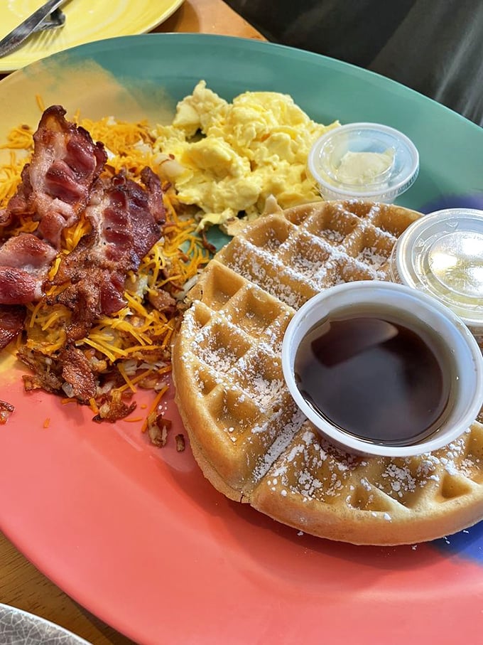 Waffles dusted with powdered sugar, served with a side of morning sunshine. Breakfast that makes you forget you're not a morning person.