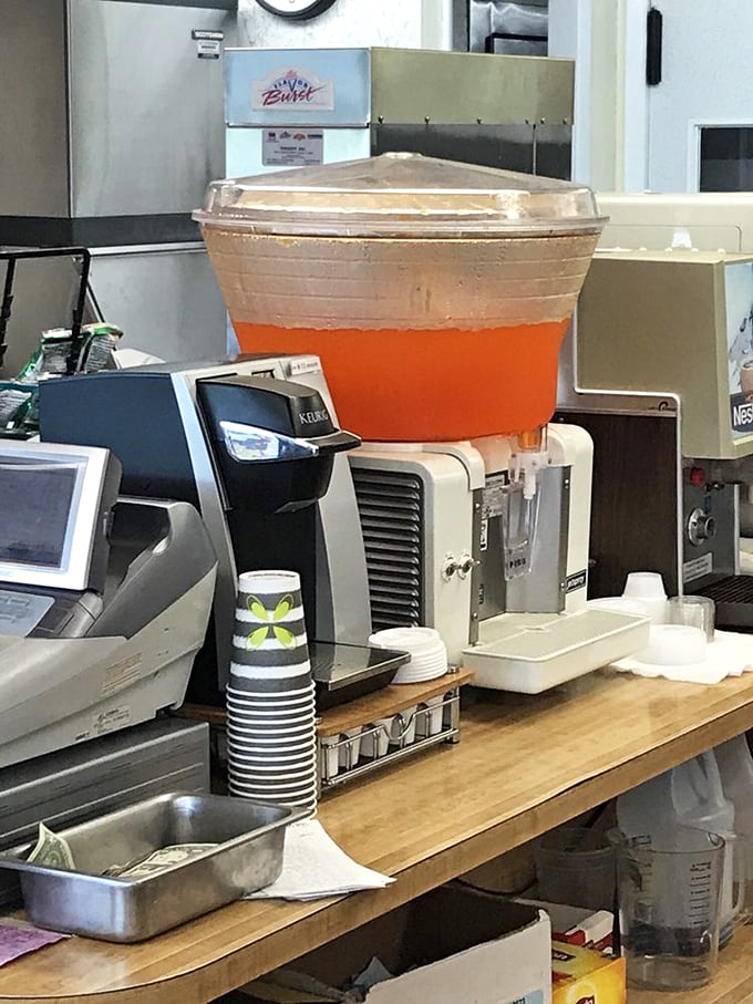 That orange beverage dispenser isn't just serving drinks; it's dispensing liquid sunshine to complement your crispy chicken feast.