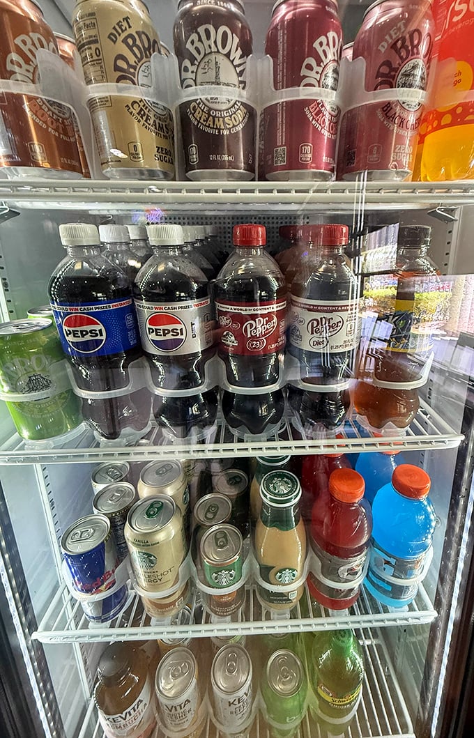 The beverage case—where decisions get complicated. Do you go classic with a Pepsi or fancy with a Starbucks? Life's important questions happen here.