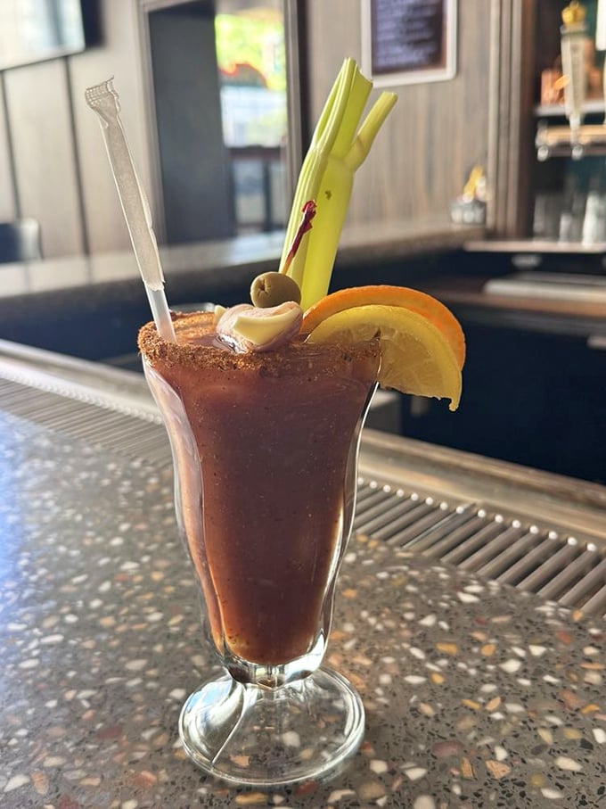 The Bloody Mary arrives like a botanical garden in a glass, garnished with enough vegetables to count as your first serving of the day.