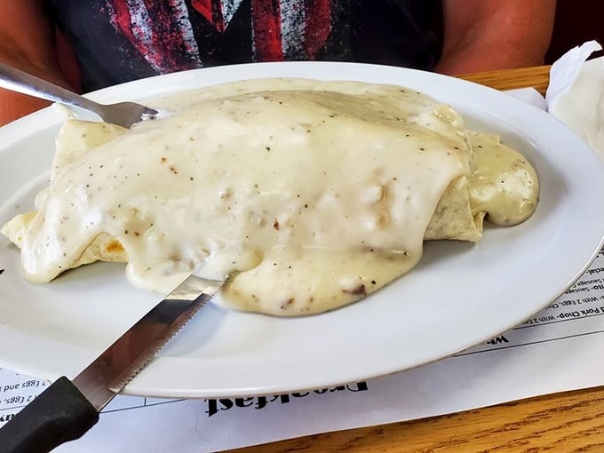 Beneath that blanket of country gravy lies breakfast nirvana. Not all heroes wear capes—some wear a coating of peppery white sauce instead.