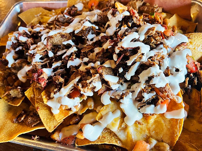 Nachos that have achieved their highest purpose in life. When chips meet brisket, it's not a snack—it's a religious experience.