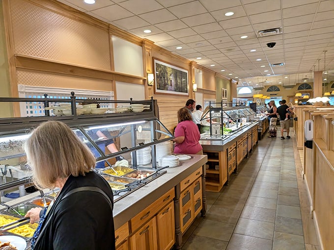 The buffet line stretches like a runway of homestyle delights, where patience is rewarded with perfectly maintained steam-table treasures.