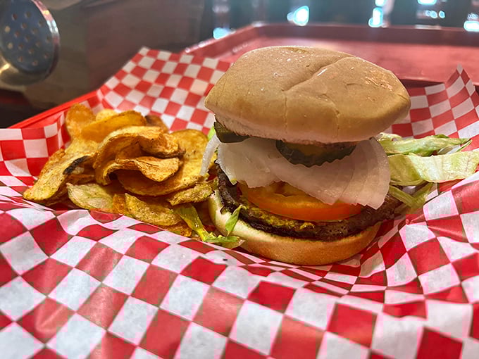 Sometimes simplicity wins—a perfectly grilled burger with crispy homemade chips that'll make you forget fancy restaurant versions ever existed.