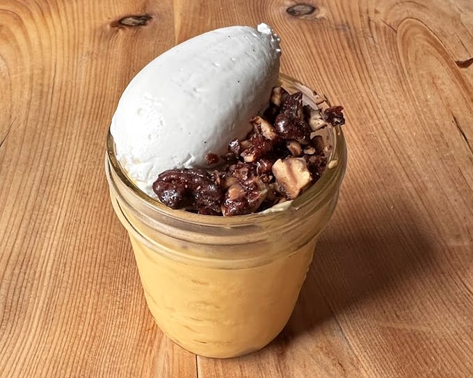 This butterscotch pudding in a mason jar isn't just dessert – it's childhood nostalgia that somehow got a graduate degree in sophisticated comfort.